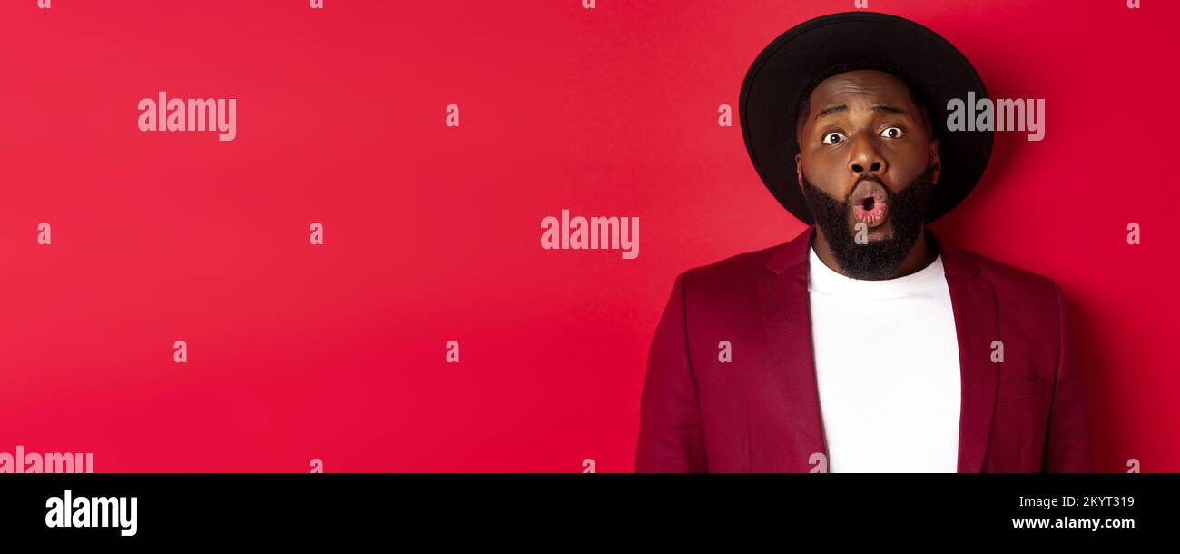 Close-up of surprised Black man staring at camera with wonder, standing ...