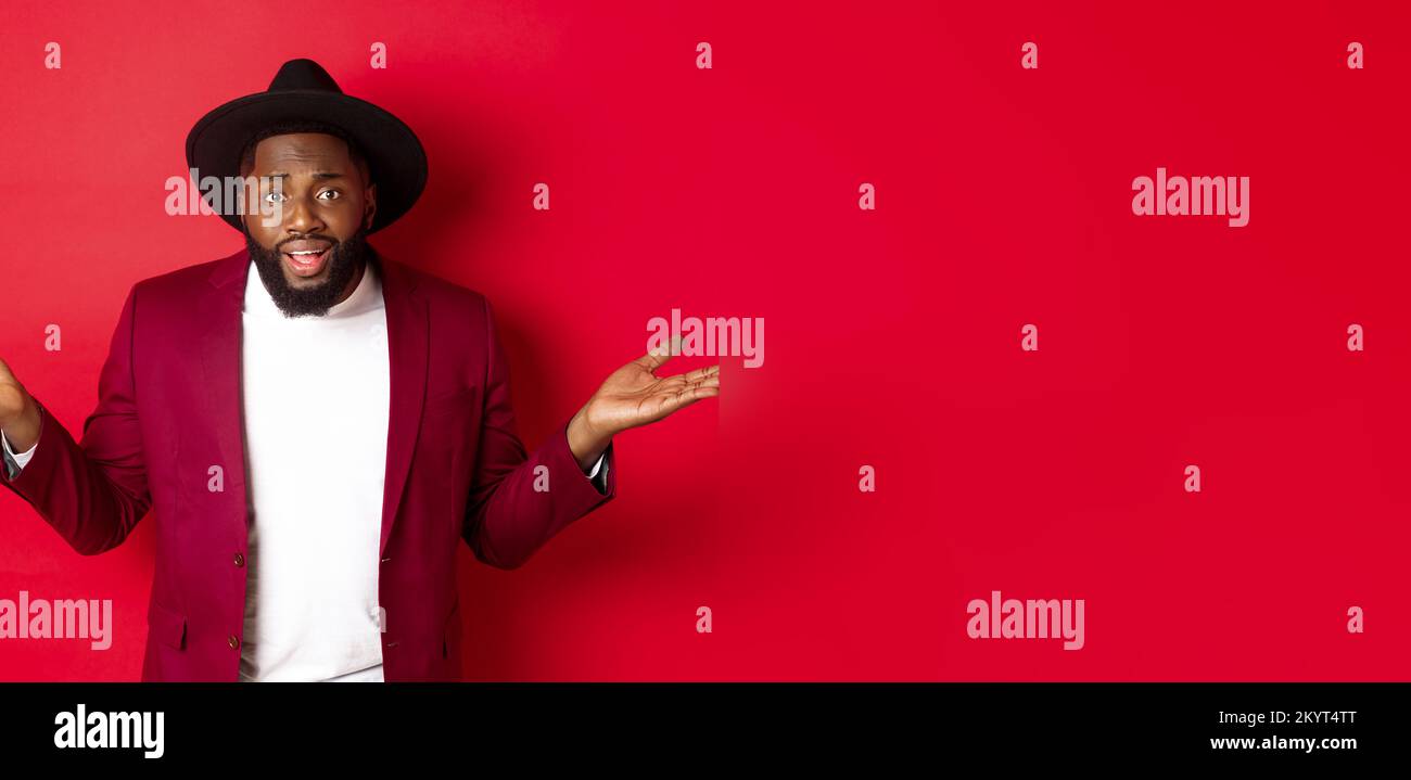 Image of confused Black man asking question, spread hands sideways and ...