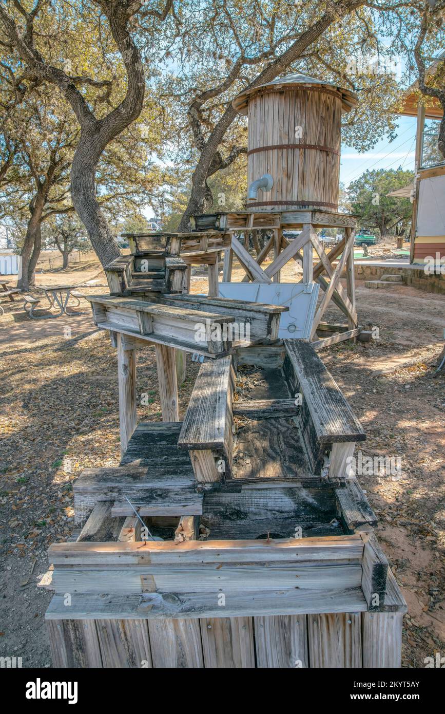 Small vinatge wood water storage tank with metal pipe and wooden ...