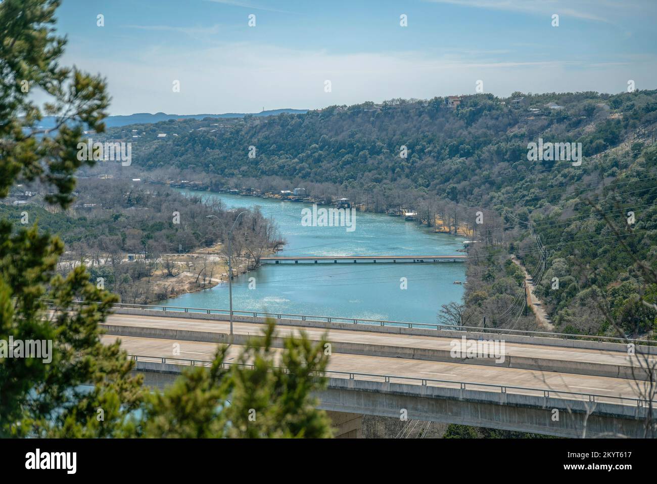 View from Lake Austin Dam of the Colorado River with concrete road ...