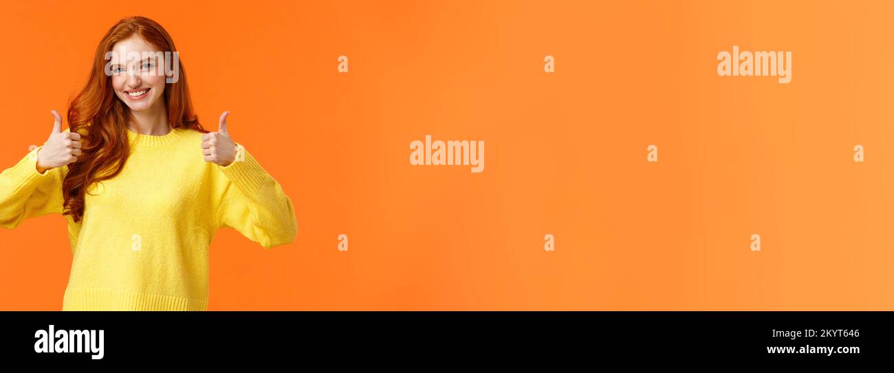 Confident and caring good-looking redhead sister rooting for sibling ...