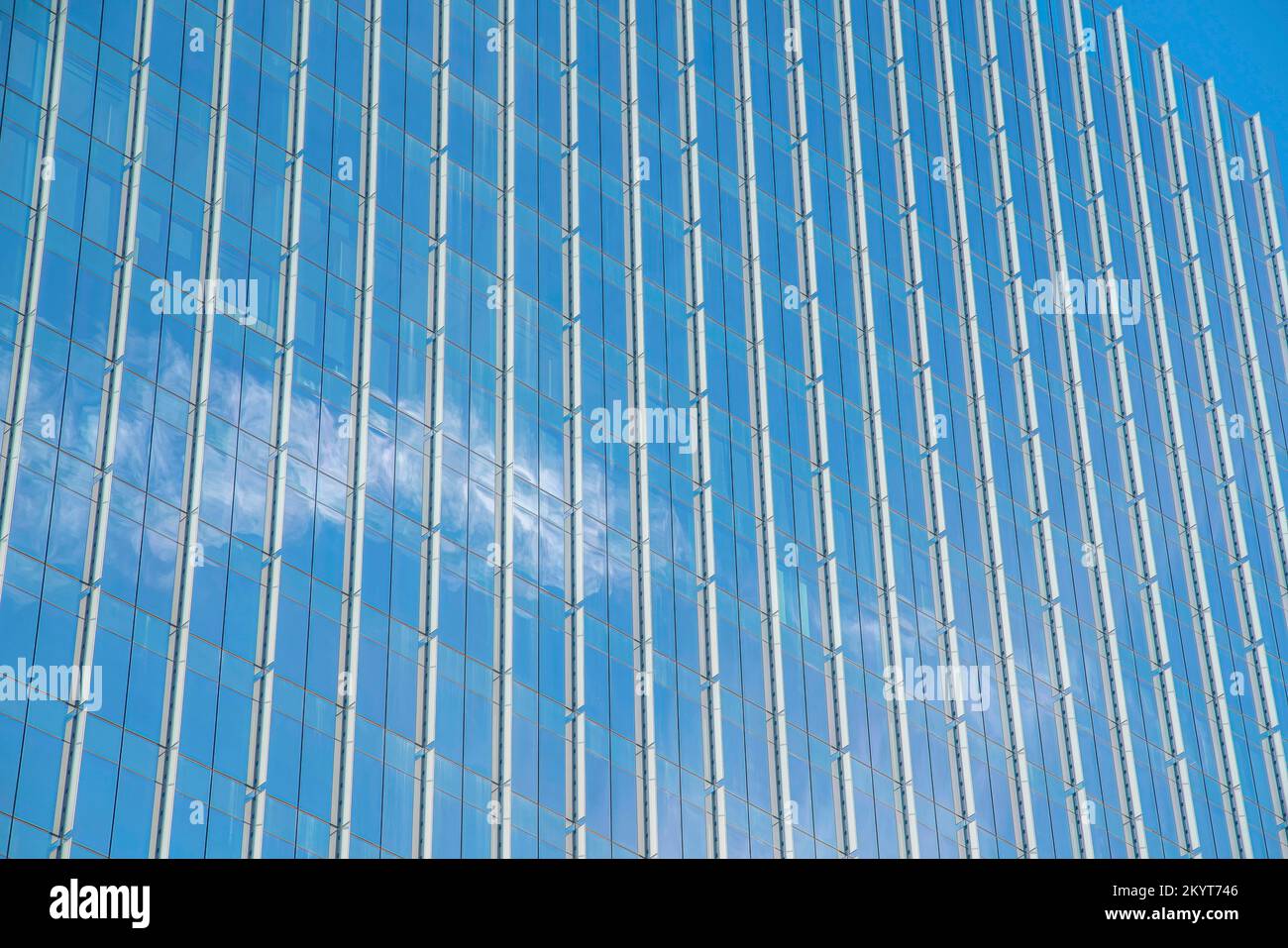 Modern building with a modern glass exterior that reflects the clear ...