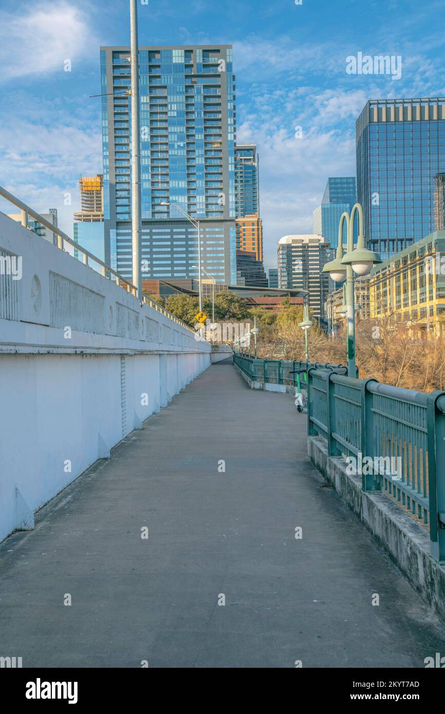 Walkway along the Colorado River in Austin Texas overlooking modern ...