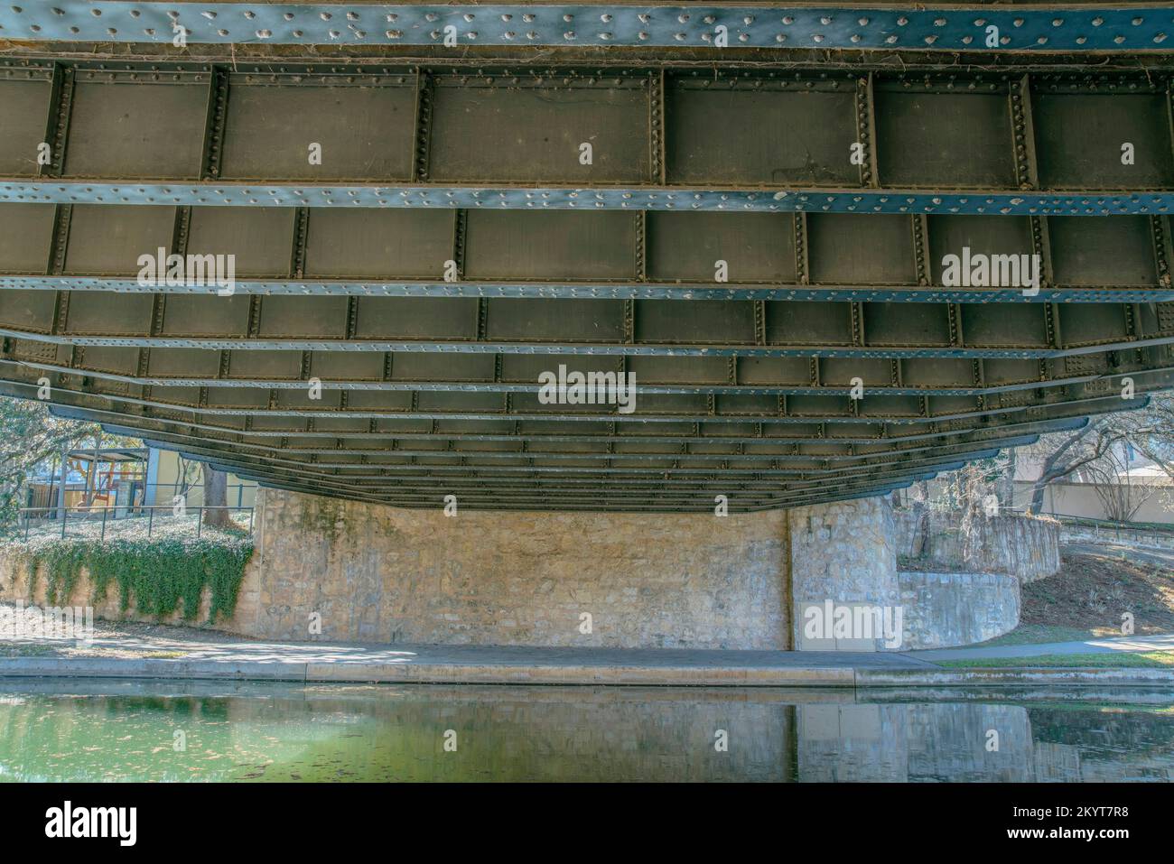 Underside of a bridge that runs over the canal in San Antonio River ...