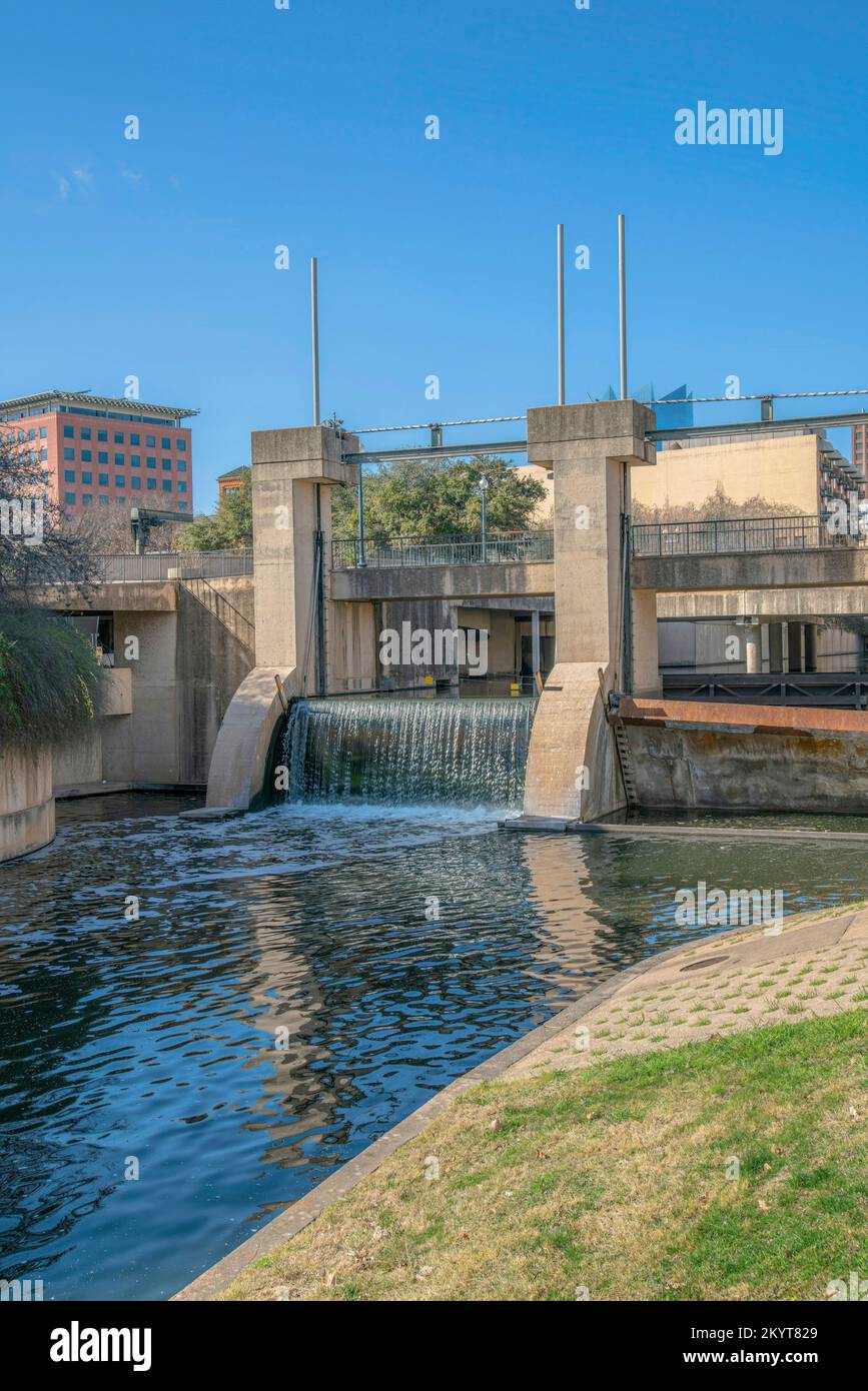 Sunny landscape of a canal and park at the San Antonio River Walk in ...