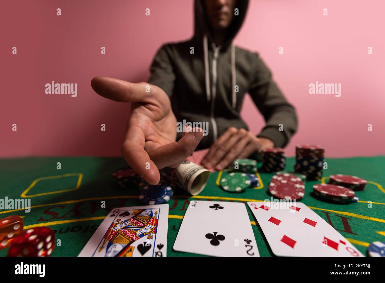 Happy poker player winning and holding cards Stock Photo - Alamy