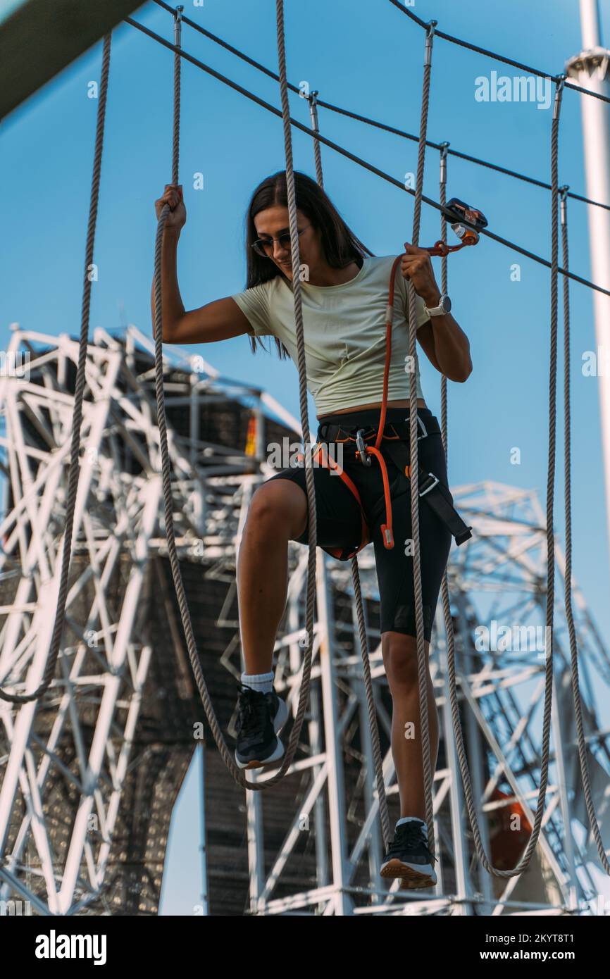Woman handling the hardest rope level with no difficulty in an ...