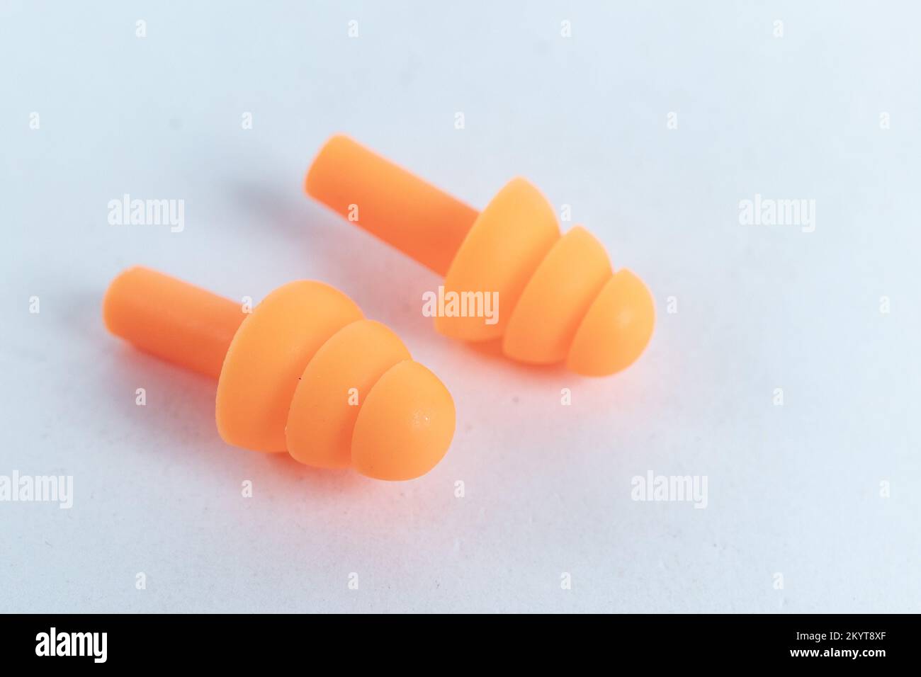 Silicone ear plugs for human ears on white background Stock Photo - Alamy