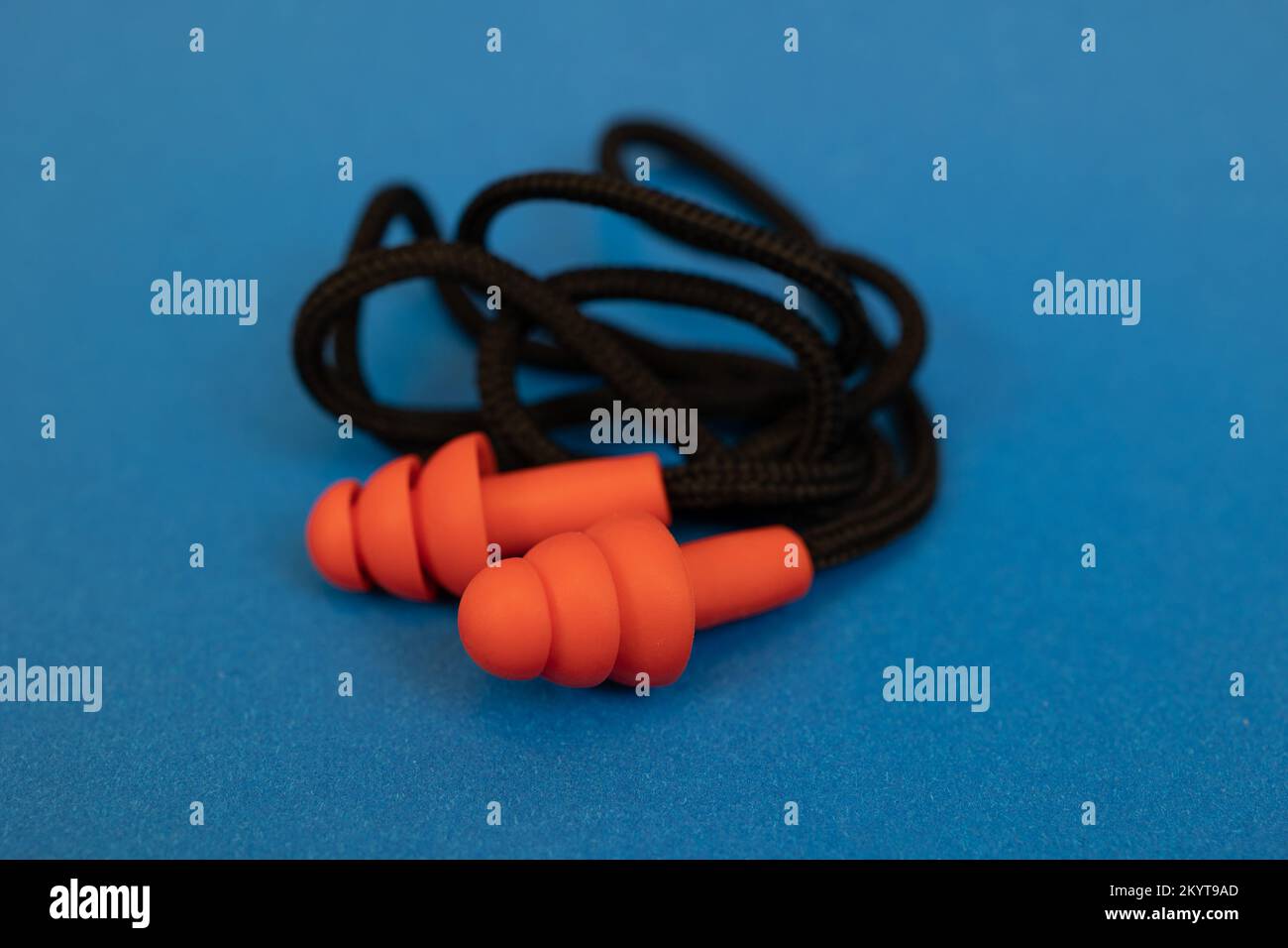 Silicone ear plugs for human ears on blue background Stock Photo - Alamy