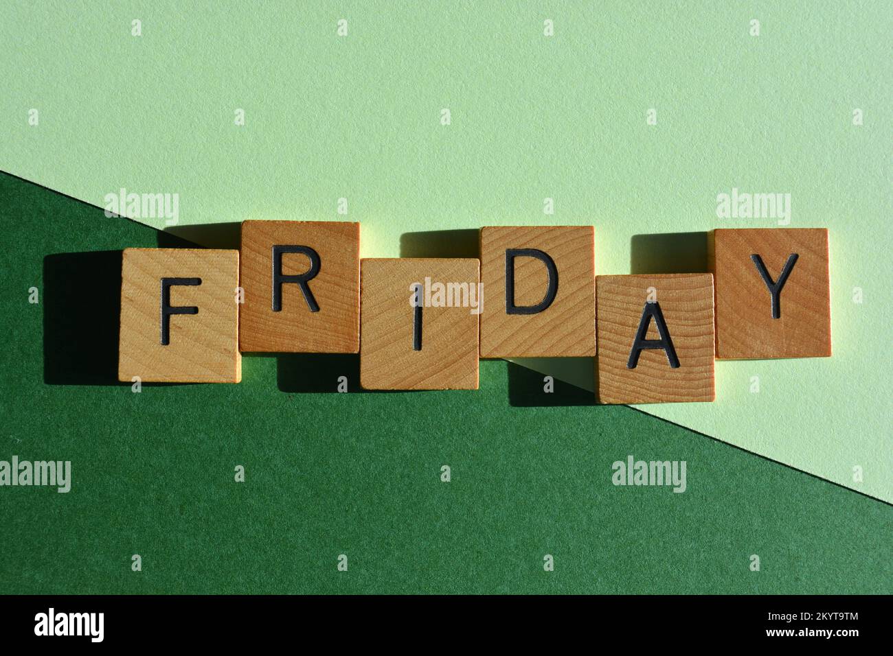 Friday, word in wooden alphabet letters isolated on green background ...