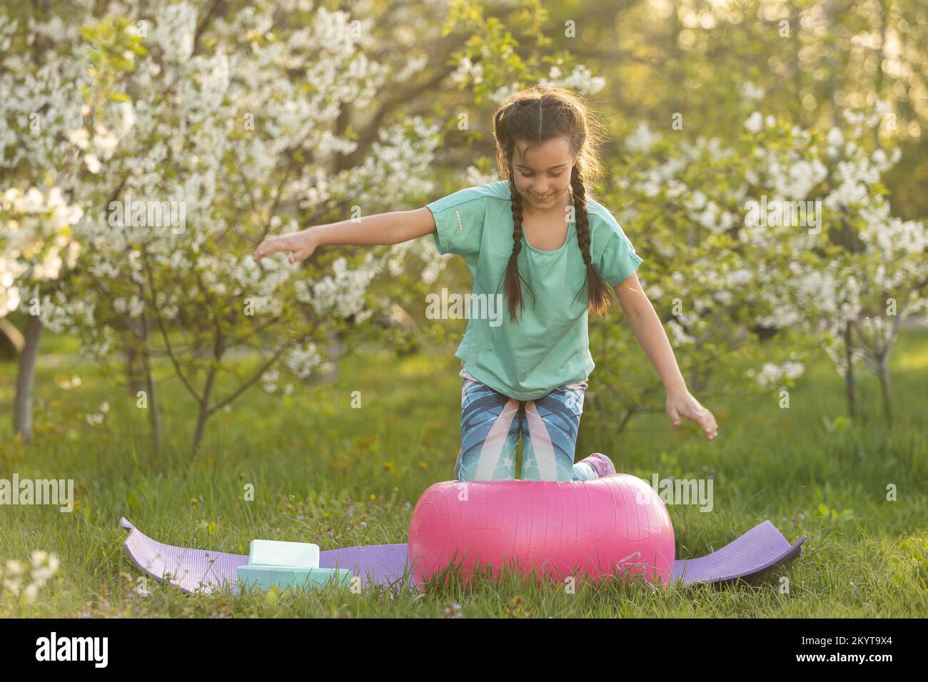 child doing gymnastics exercises. Sports, learning, fitness, stretching ...