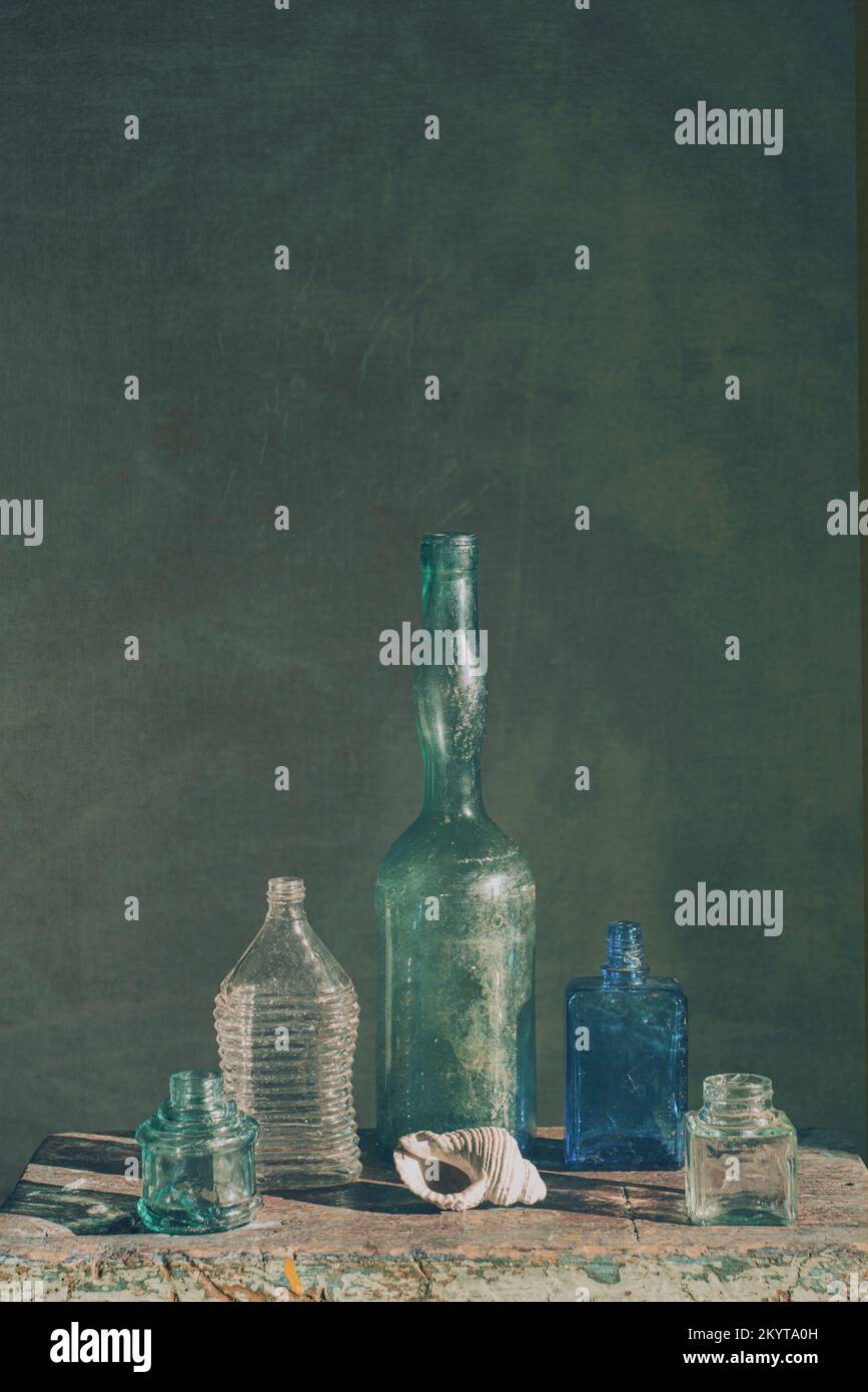 Still Life with differently shaped glass bottles. High quality photo ...