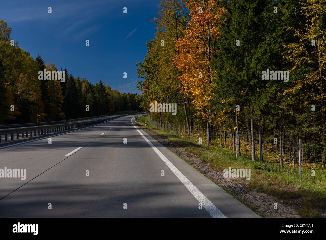 Highway wide road, transport and blue sky with clouds on a summer day ...
