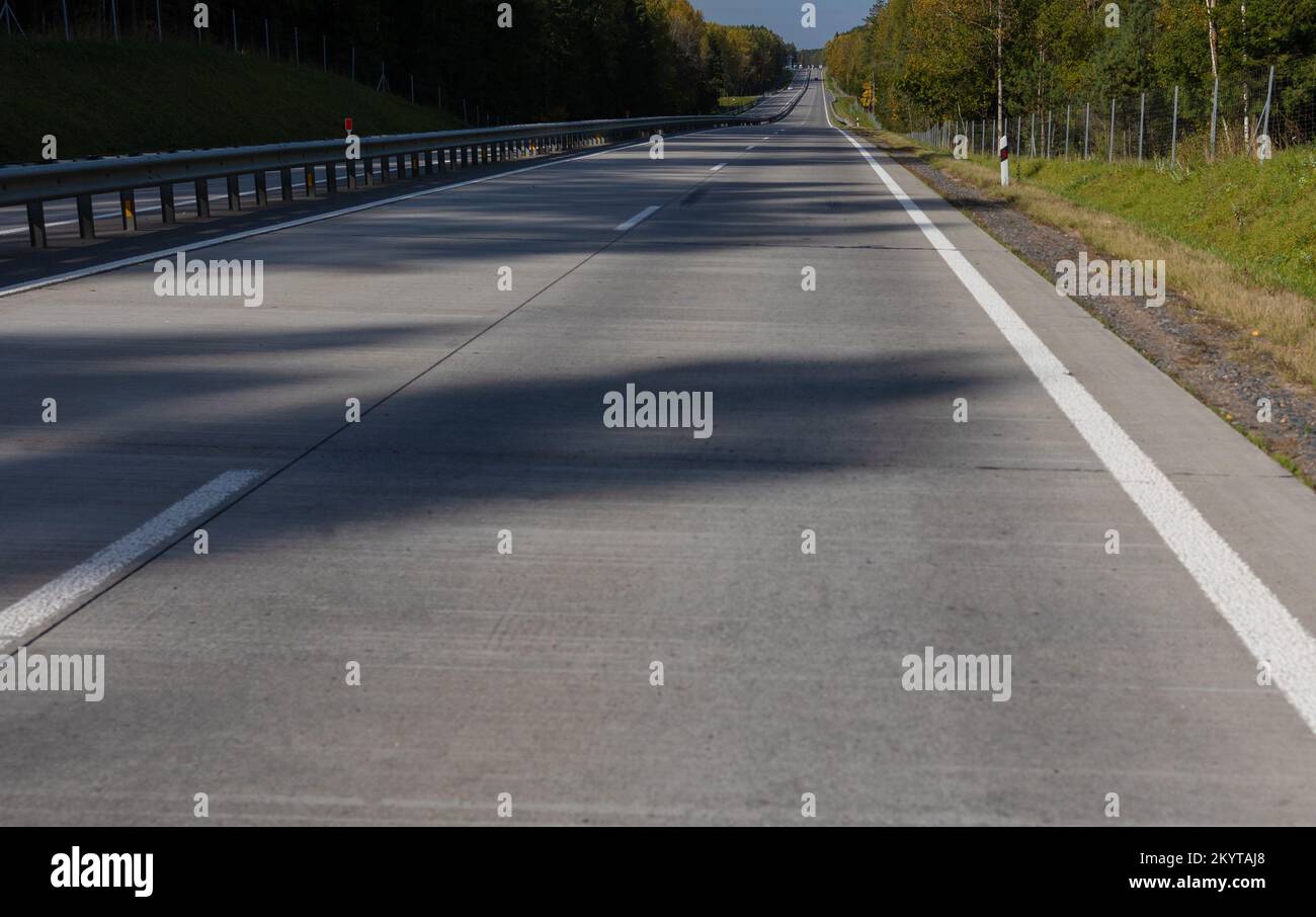 Highway wide road, transport and blue sky with clouds on a summer day ...