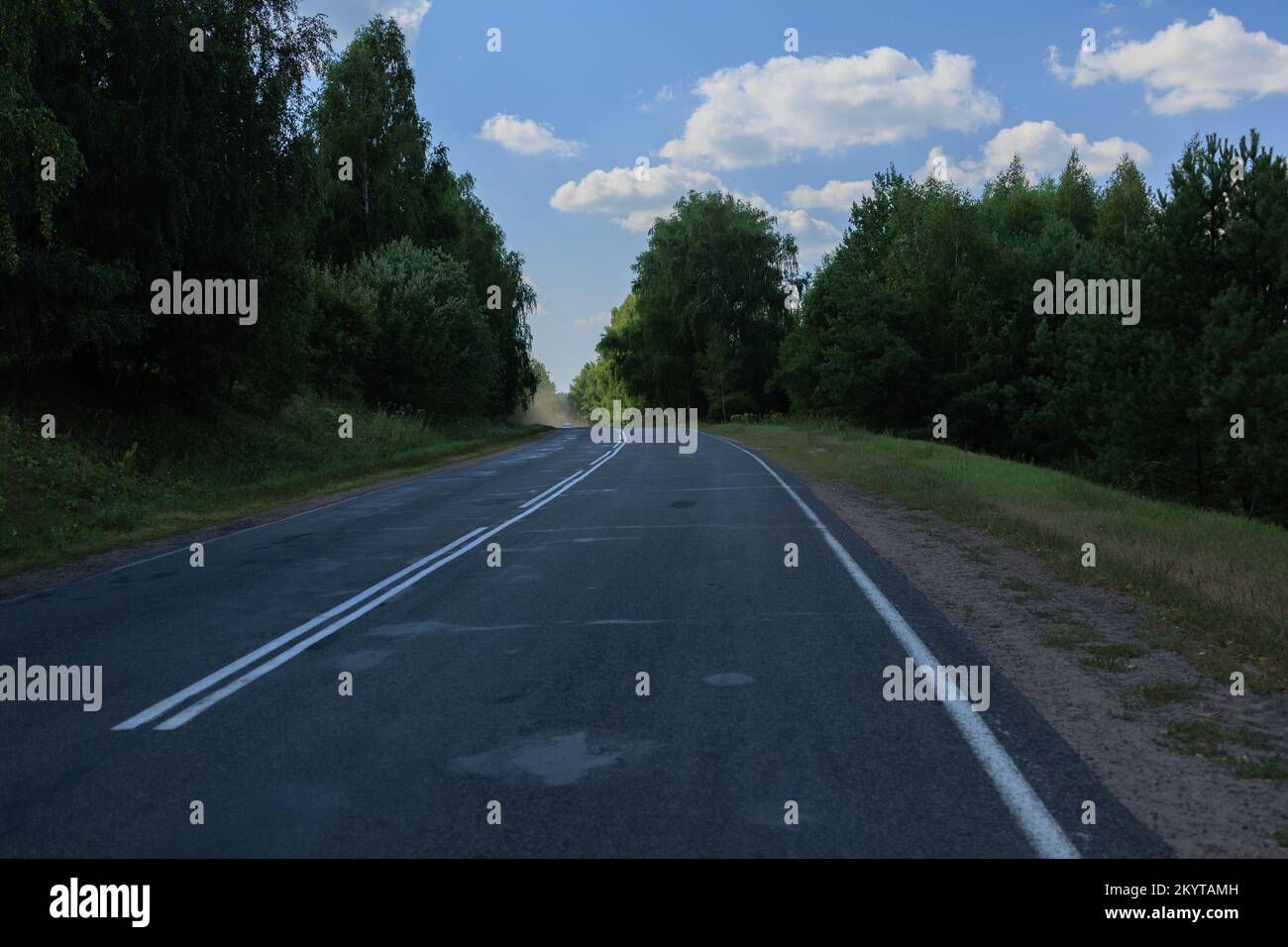 Highway wide road, transport and blue sky with clouds on a summer day ...