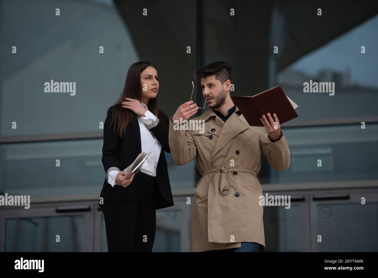 Two business people are thinking of a solution while discussing it ...