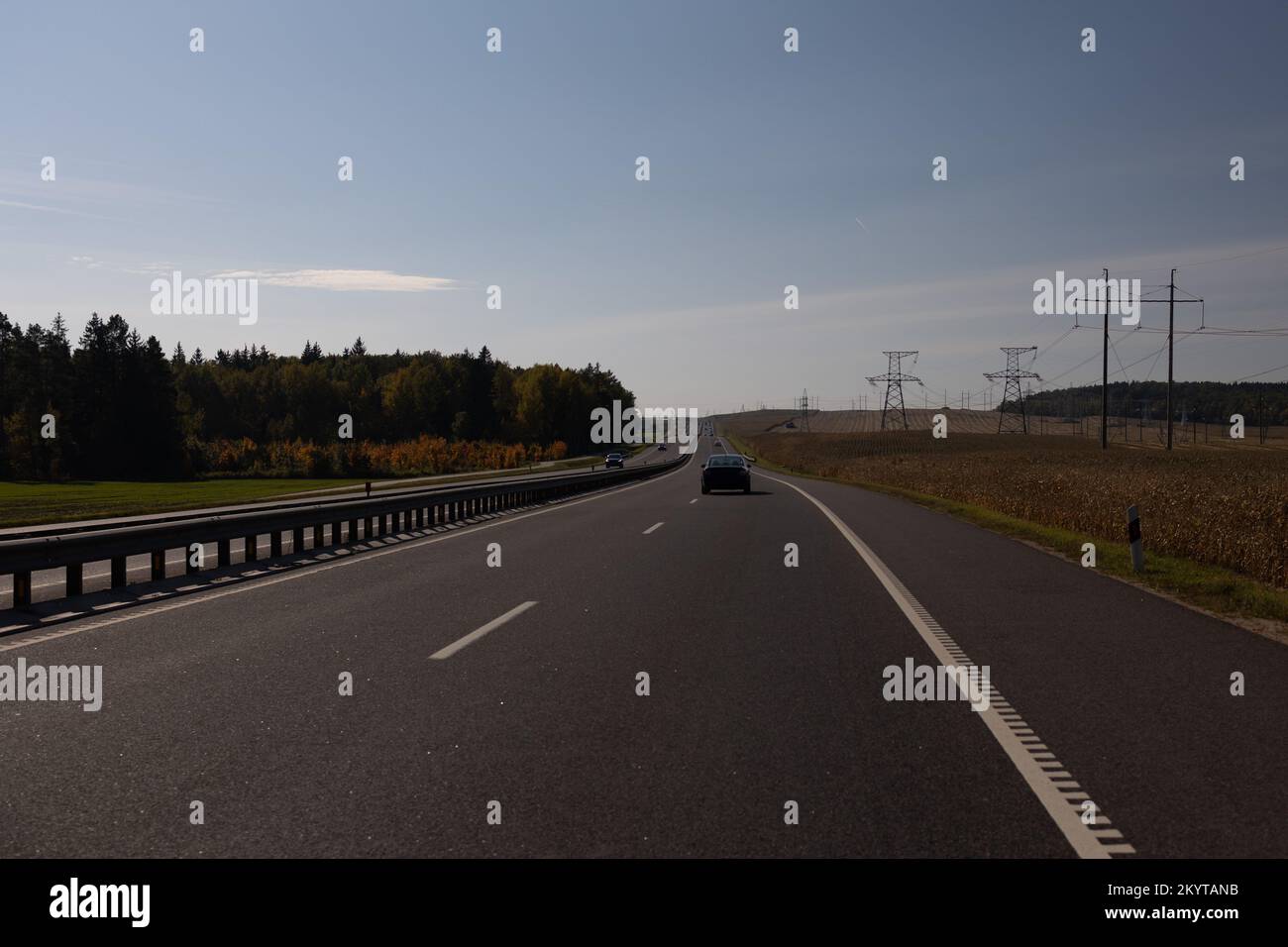 Highway wide road, transport and blue sky with clouds on a summer day ...