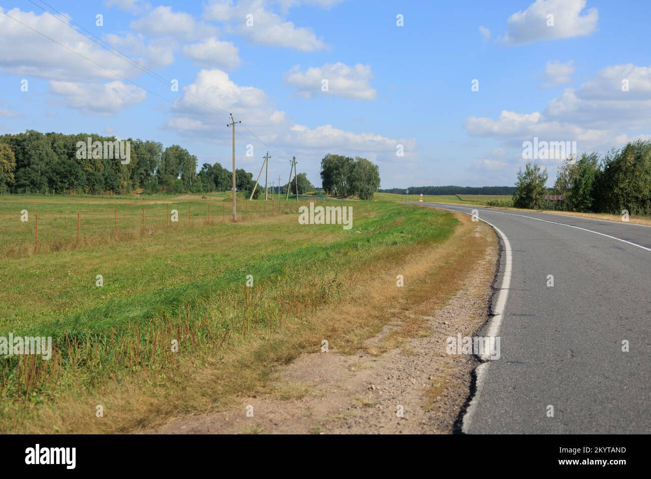 Highway wide road, transport and blue sky with clouds on a summer day ...