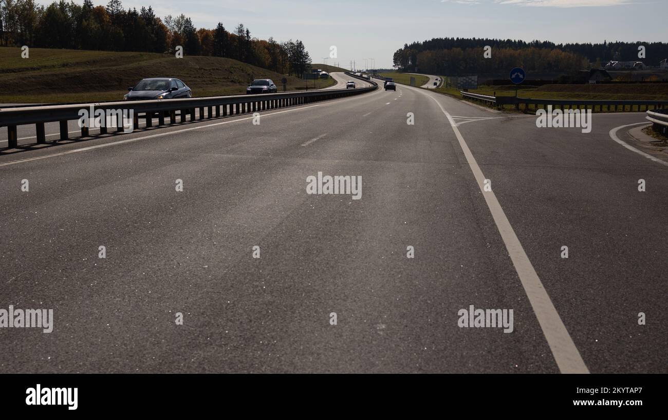 Highway wide road, transport and blue sky with clouds on a summer day ...