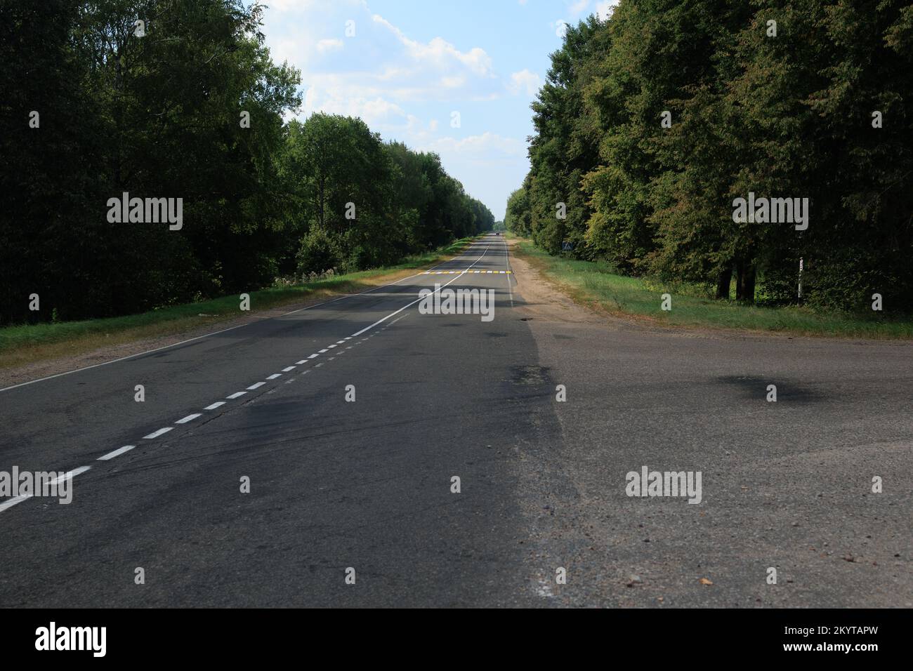 Highway wide road, transport and blue sky with clouds on a summer day ...