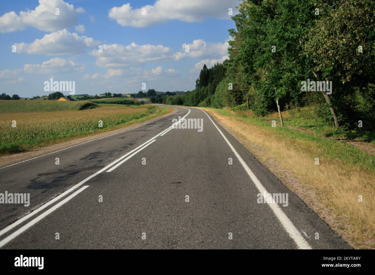 Highway wide road, transport and blue sky with clouds on a summer day ...