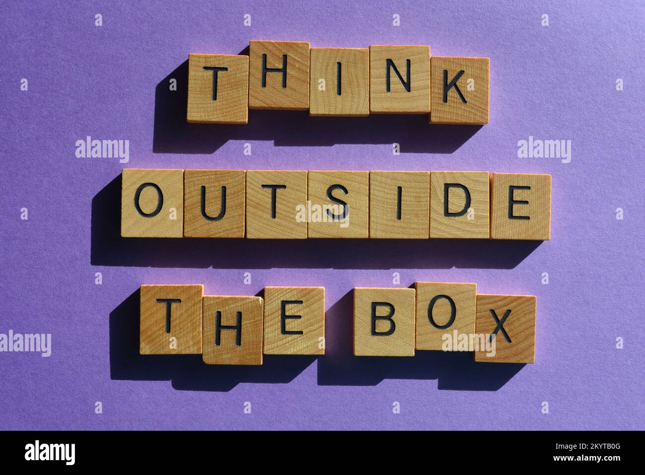 Think Outside The Box, words in wooden alphabet letters isolated on ...