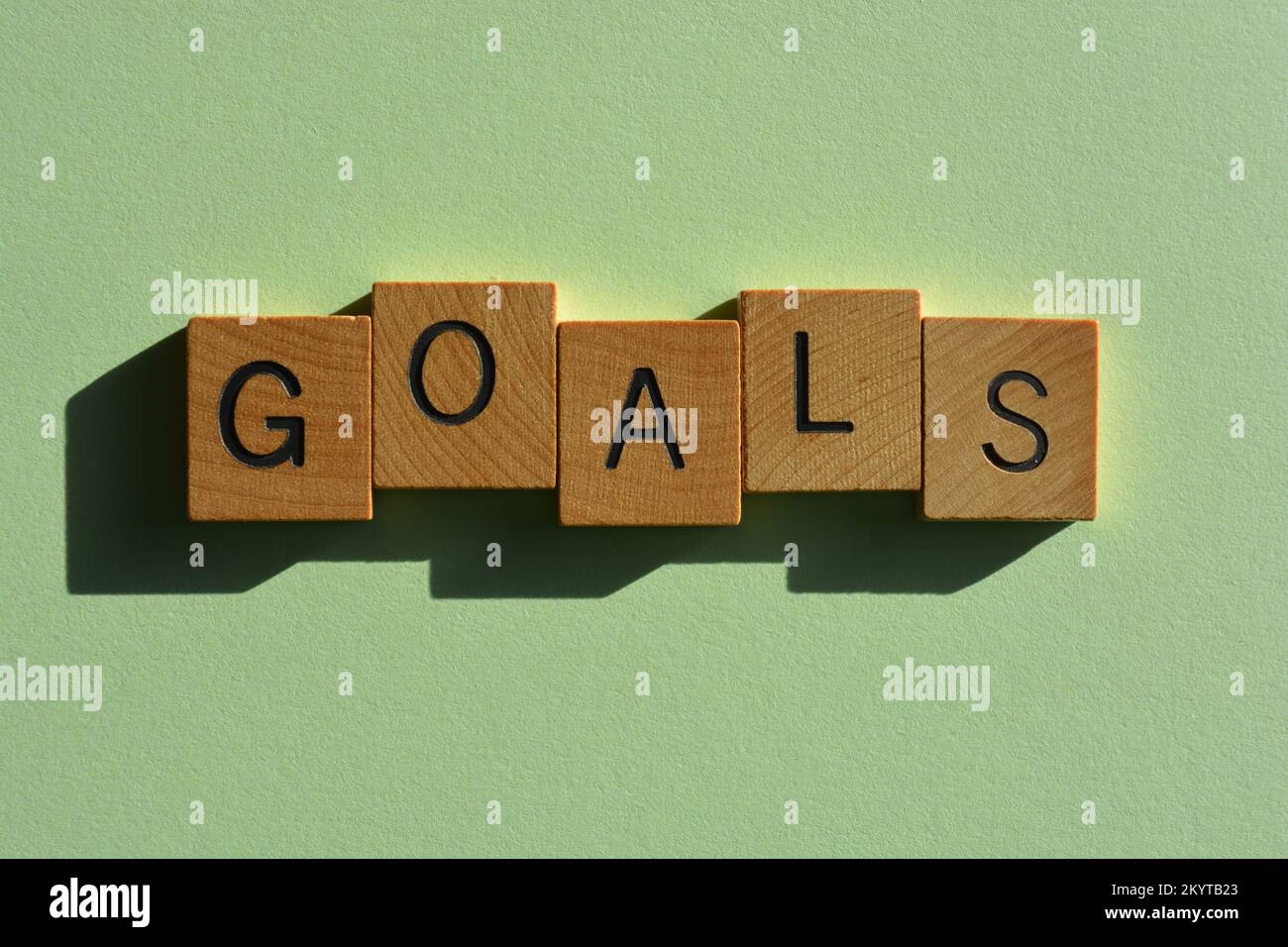 Goals, word in wooden alphabet letters isolated on green background ...