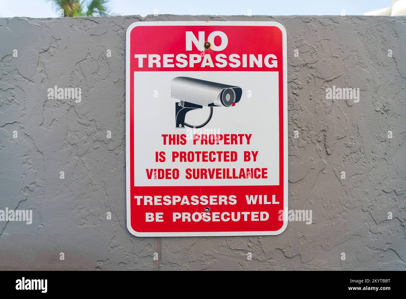 No Trespassing sign on white concrete fence in Destin Florida private ...