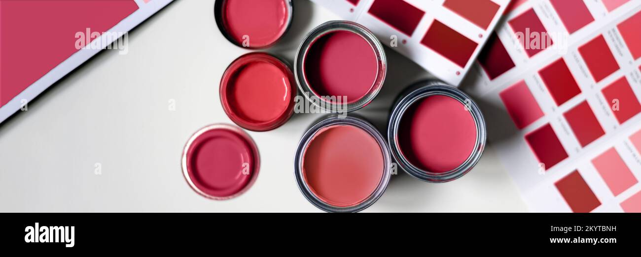 Tiny sample paint cans during house renovation, process of choosing ...