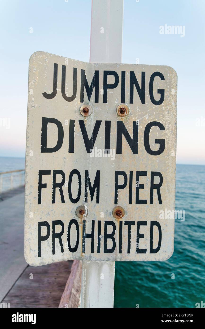Jumping Diving From Pier Prohibited written on a sign board in Destin ...