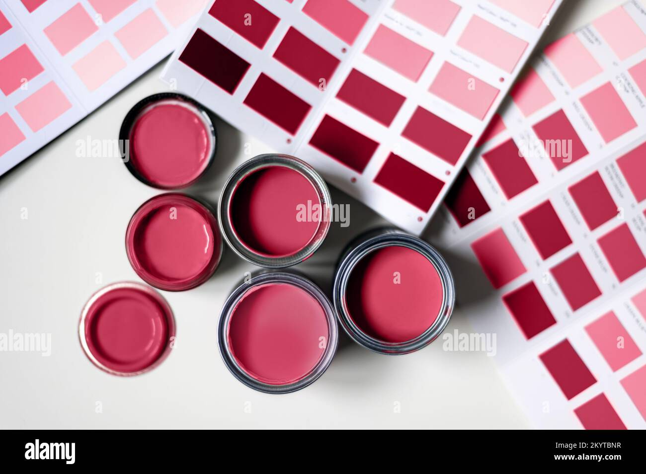 Tiny sample paint cans during house renovation, process of choosing ...