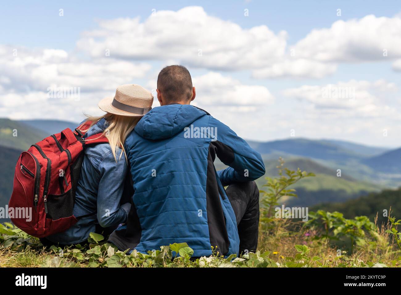 Portrait of beautiful young couple enjoying nature at mountain peak Stock Photo - Alamy