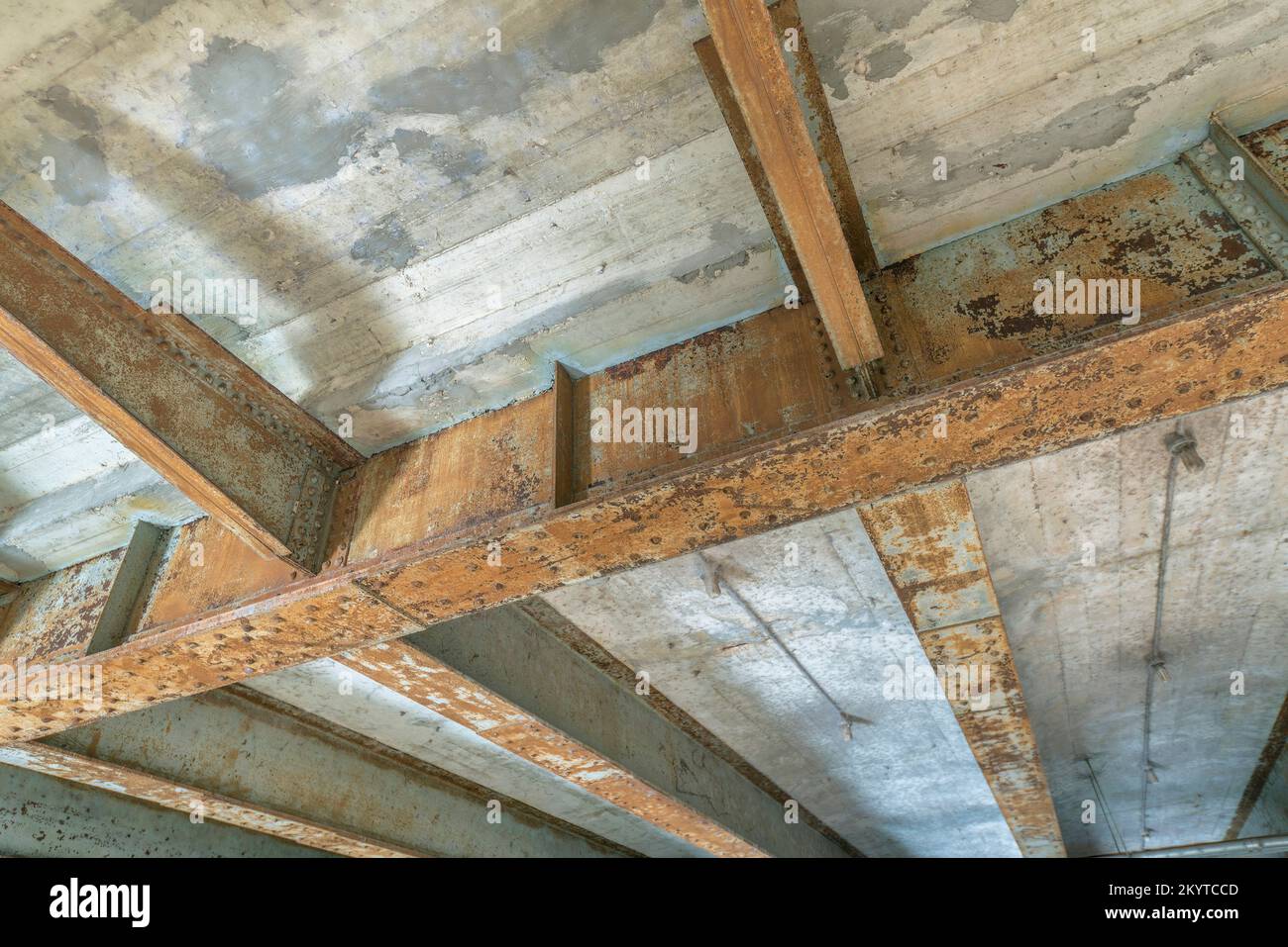 Rusty metal beams supporting the concrete bridge at River Walk in San ...