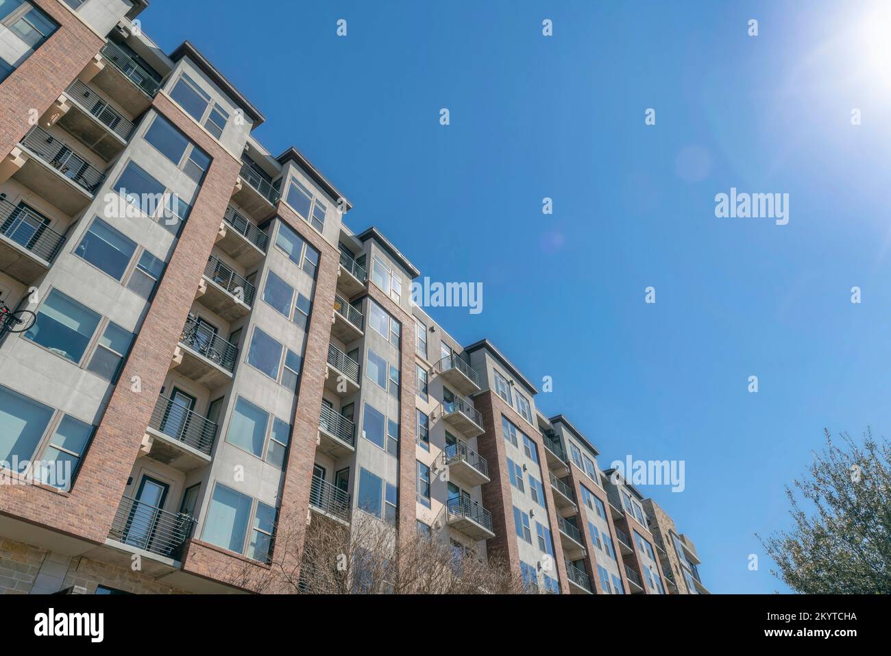 Austin, texas- Mid-rise apartment complex in a low angle view. Facade ...