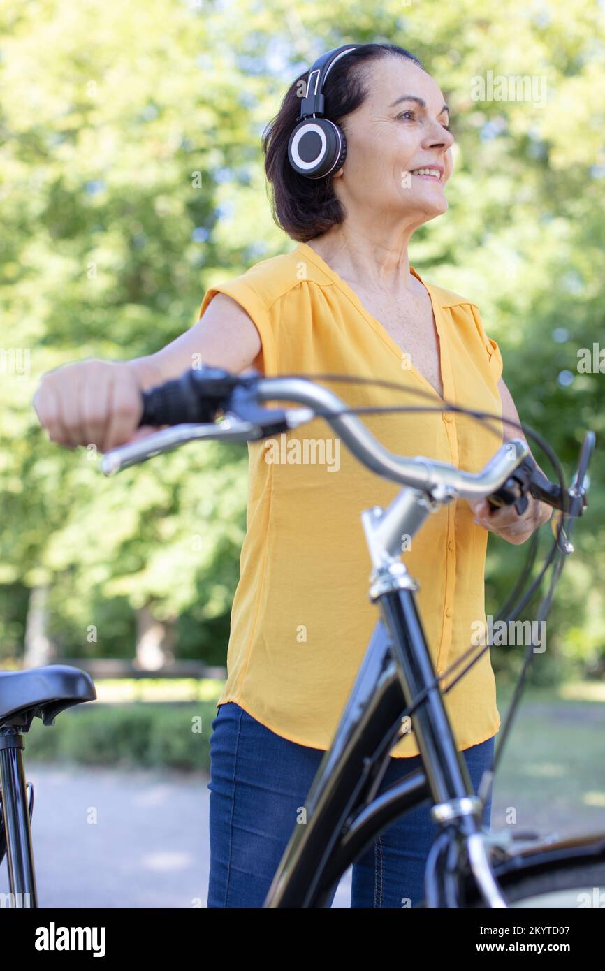 senior spinning woman listening music Stock Photo - Alamy