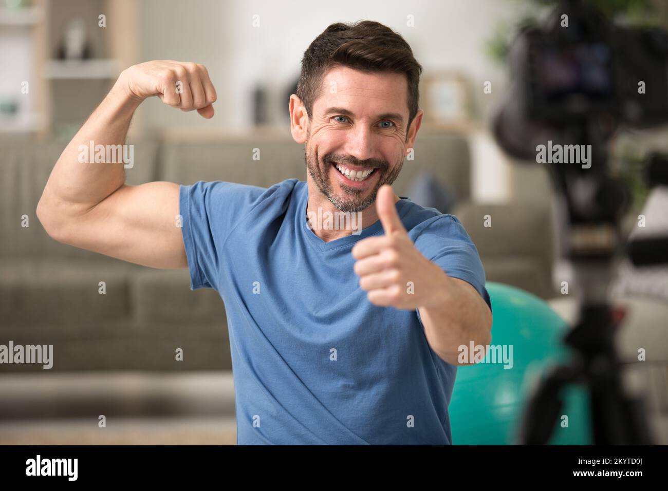 man showing his arm muscle Stock Photo - Alamy
