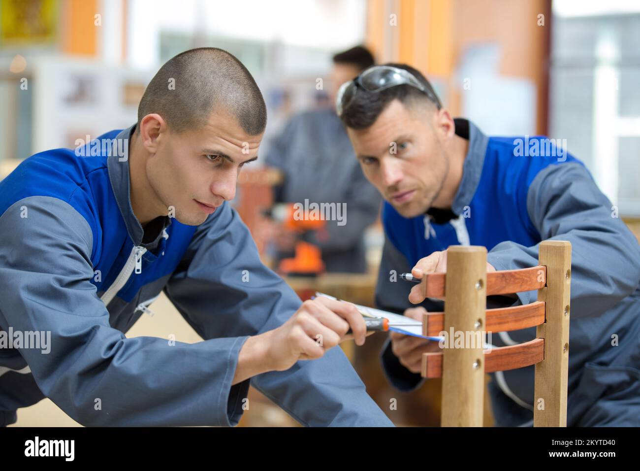 Man fixing leg table hi-res stock photography and images - Alamy