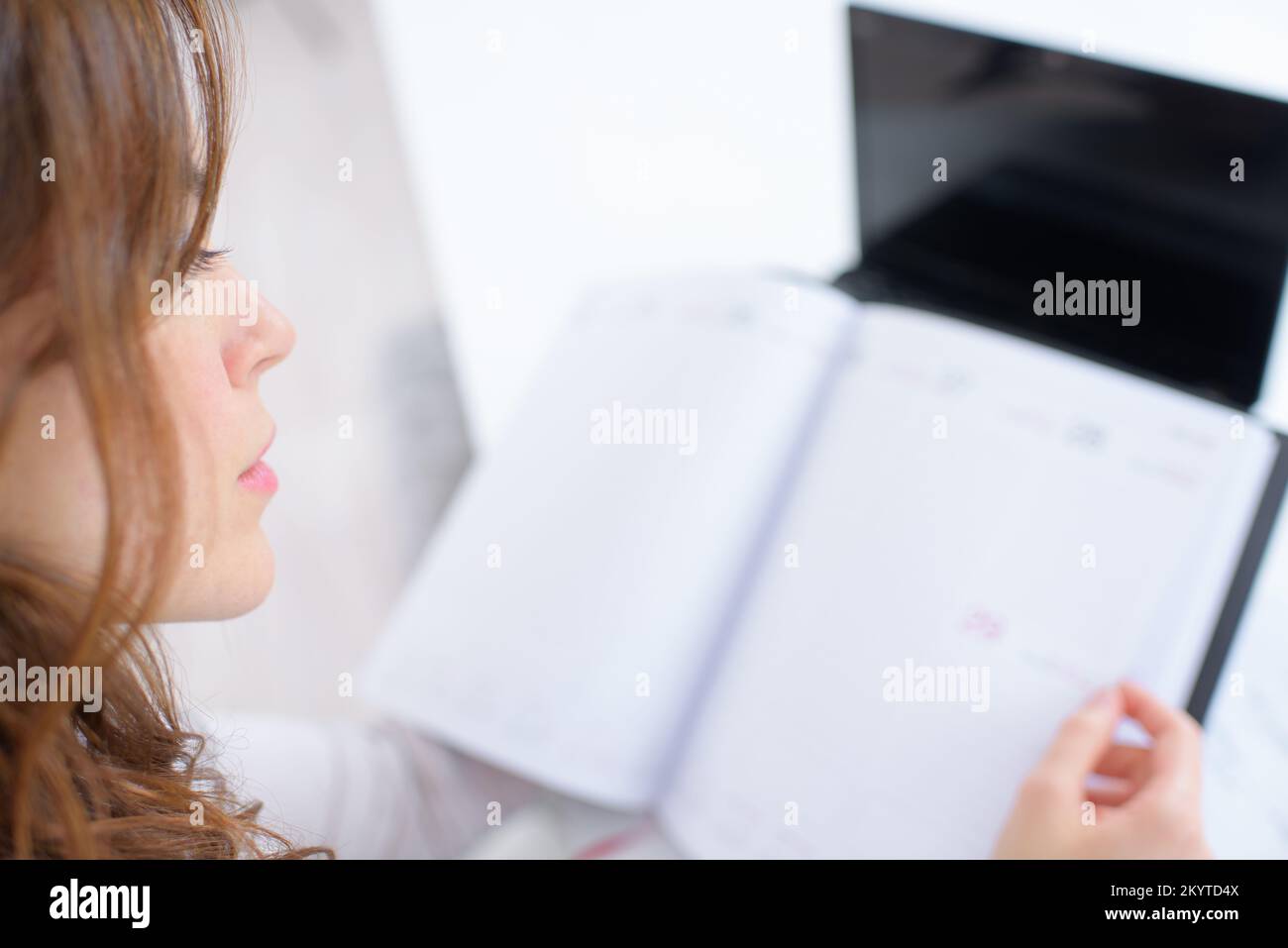 Woman diary consult hi-res stock photography and images - Alamy