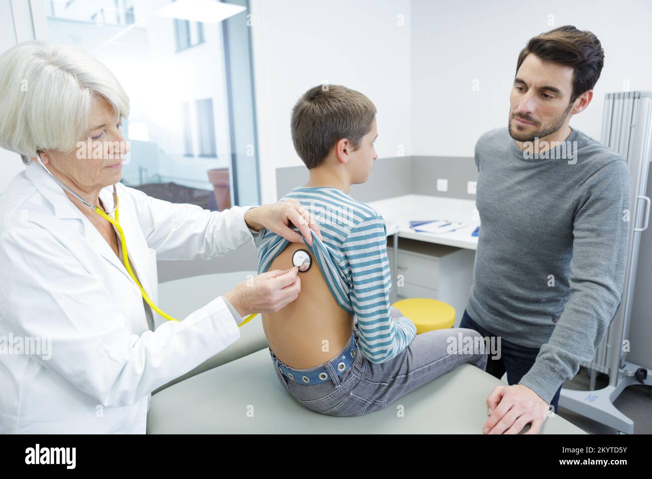 doctor examining a child in a hospital Stock Photo - Alamy