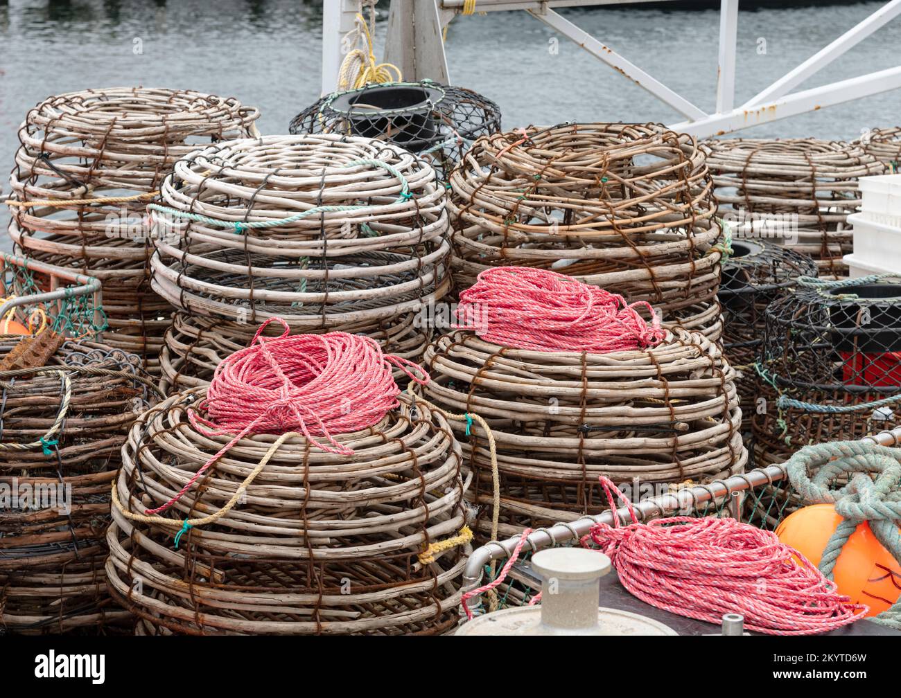 Lobster pots stacked on the deck of a fishing vessel waiting to be laid ...