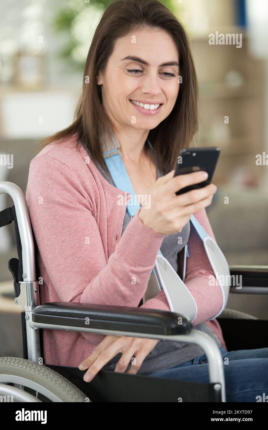 disabled girl delighted to read message on cellphone Stock Photo - Alamy