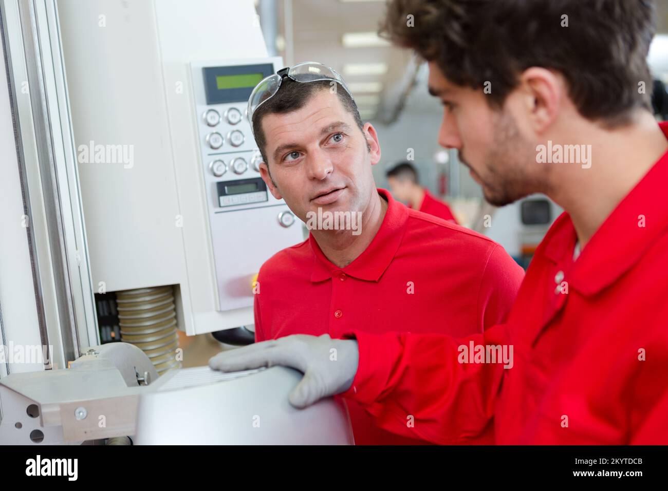 factory job done by two men Stock Photo - Alamy