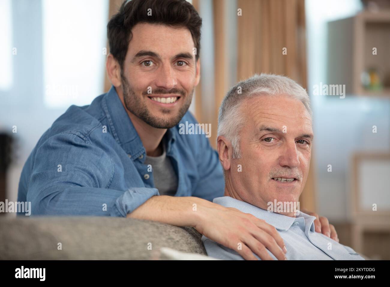 Man relaxes home smiling hi-res stock photography and images - Alamy