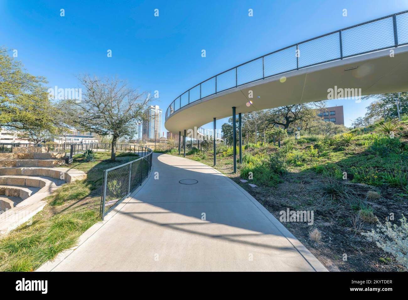 Austin, Texas- Concrete walkway with chainlink railings at Waterloo ...