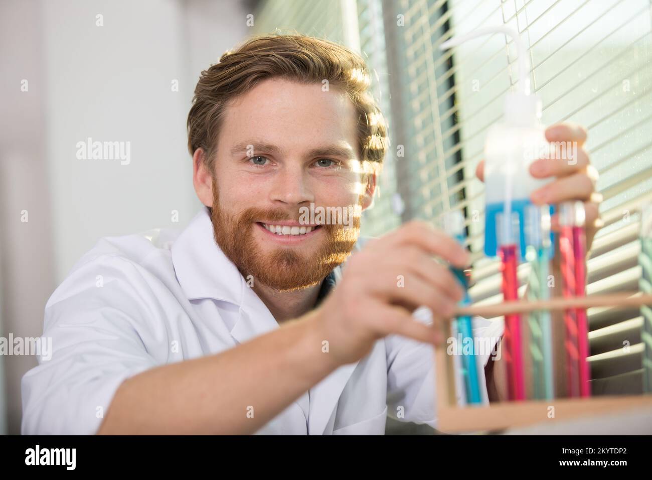 Scientist working test tubes in hi-res stock photography and images - Alamy