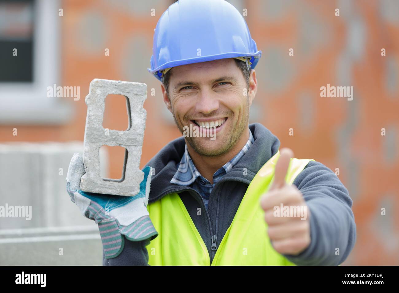 italian foreman is carrying concrete wall while showing thumb up Stock ...