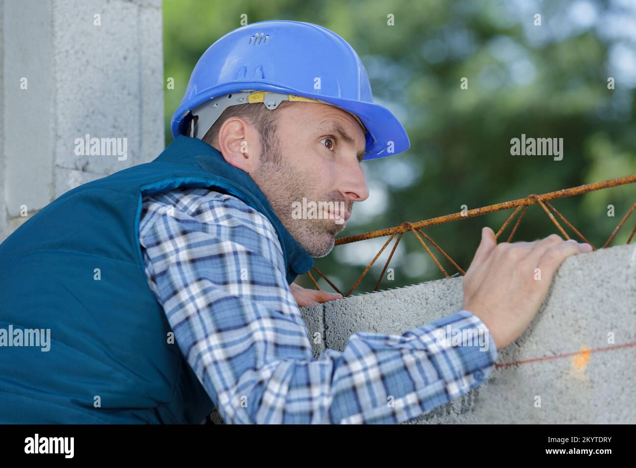 foreman builder inspecting concrete construction work Stock Photo - Alamy