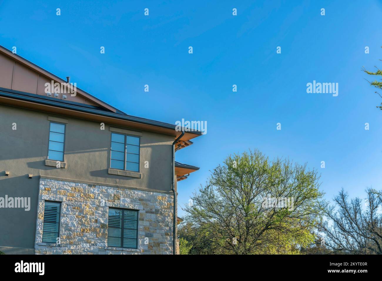 Austin, Texas- Side exterior of a house near Lake Austin against the ...