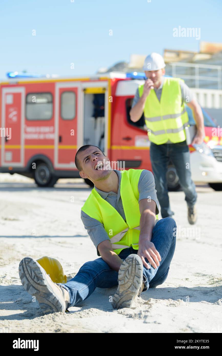 injured lying worker at work Stock Photo - Alamy