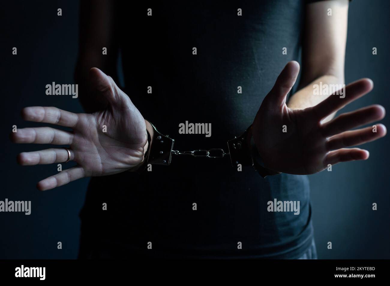 Woman handcuffs behind back hi-res stock photography and images - Alamy